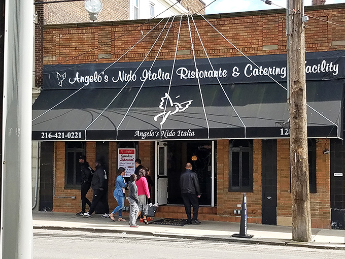Diners eagerly enter Angelo's, drawn by reputation and the promise of authentic Italian flavors that have made this Cleveland spot a destination.