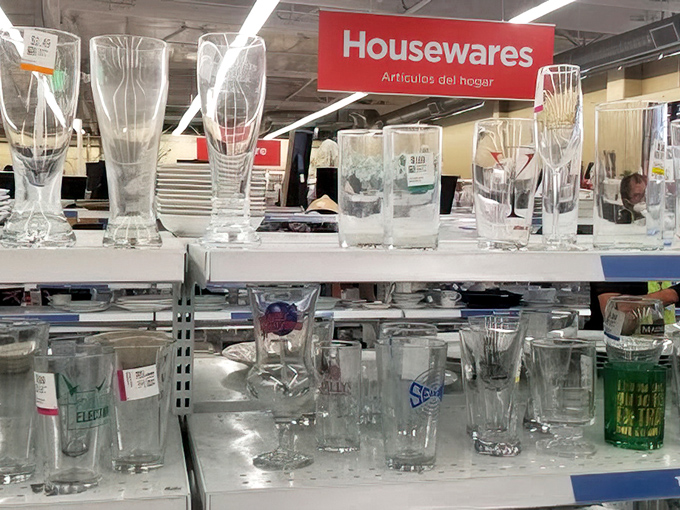 Crystal glasses catch fluorescent light, transforming ordinary shelves into displays worthy of fancy dinner parties.