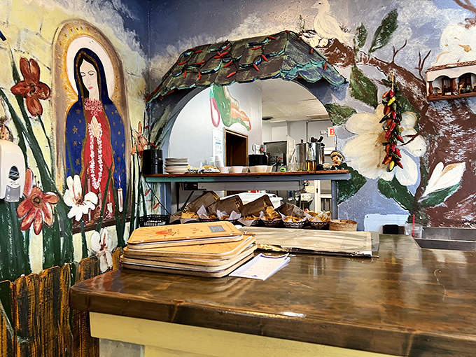 The kitchen pass reveals glimpses of culinary magic happening behind the scenes. That Virgin Mary mural isn't just decoration&mdash;she's overseeing quality control.
