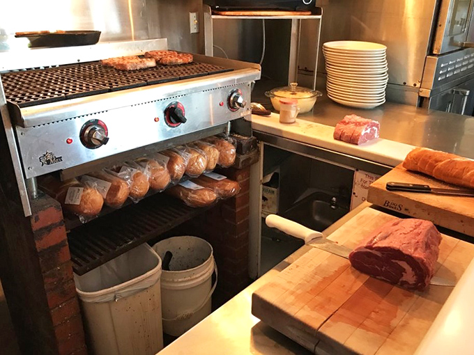Behind the scenes magic: Where prime cuts meet fire on a well-seasoned grill that's seen thousands of steaks reach perfection.