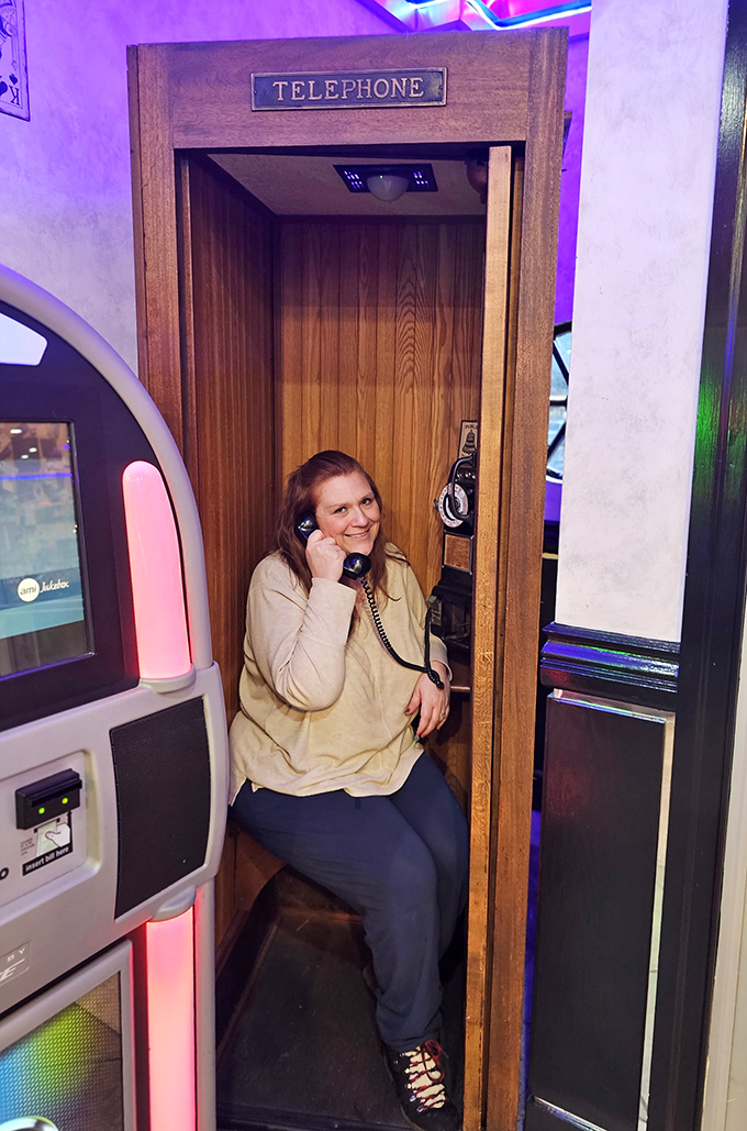 The vintage telephone booth isn't just decoration—it's a portal to simpler times when calls were events and texts were something in books.
