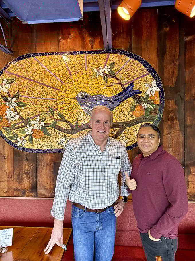 Behind that beautiful bluebird mosaic, countless breakfast dreams have come true. The wood-paneled walls have heard it all.