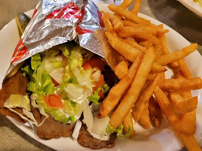 This gyro isn't just wrapped&mdash;it's embraced. Fresh veggies and seasoned meat cozied up with crispy fries that refuse to be mere sidekicks.