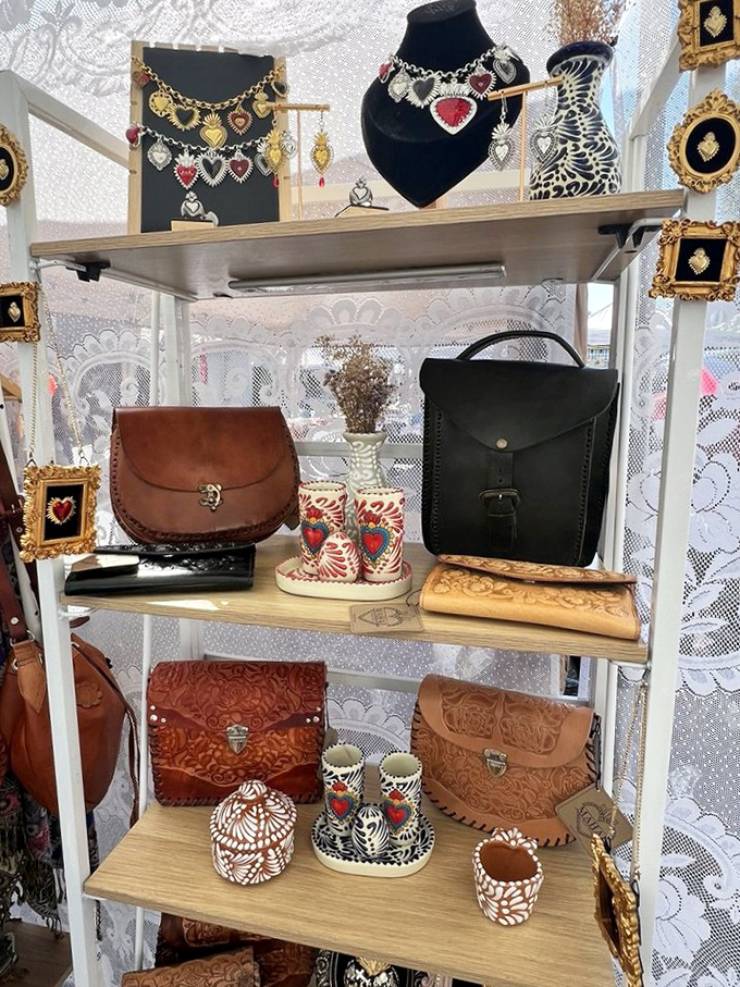 Artisanal leather goods and handcrafted jewelry transform a simple booth into a boutique experience, where craftsmanship trumps mass production.