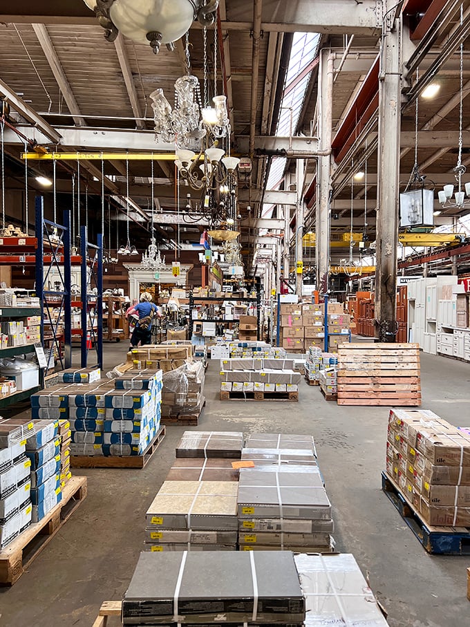 Chandeliers dangle overhead like crystalline jellyfish, casting prismatic light across an ocean of furniture possibilities below.