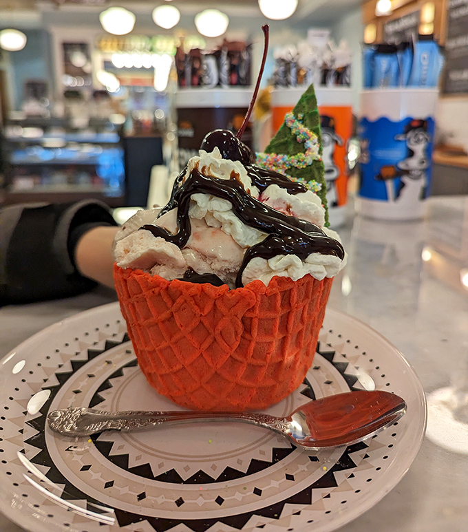 A waffle bowl sundae that makes you wonder why plates were ever invented. The edible container is nature's way of saying "leave no evidence behind."