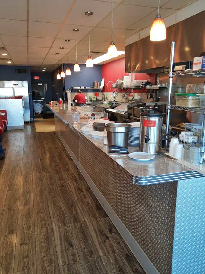 Where the magic happens. That open kitchen with pendant lighting isn't just functional—it's dinner theater where breakfast is the star performer.