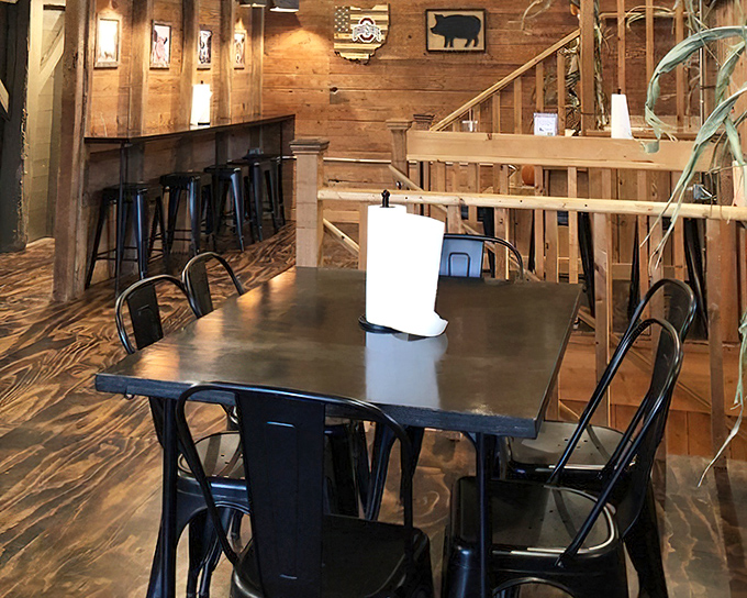 Wood-paneled walls and black metal chairs create the perfect backdrop for the real star&mdash;whatever's about to arrive on your plate.