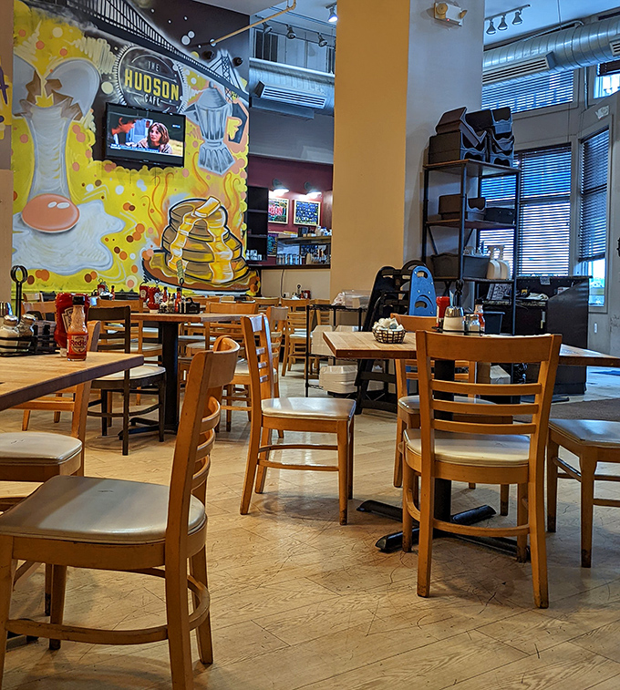 Colorful breakfast-themed murals add whimsy to the dining experience. Nothing says "morning joy" like wall-sized pancake art.