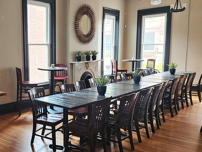 A communal table that could tell tales of first dates, business deals, and birthday celebrations. The kind of room that makes strangers into neighbors