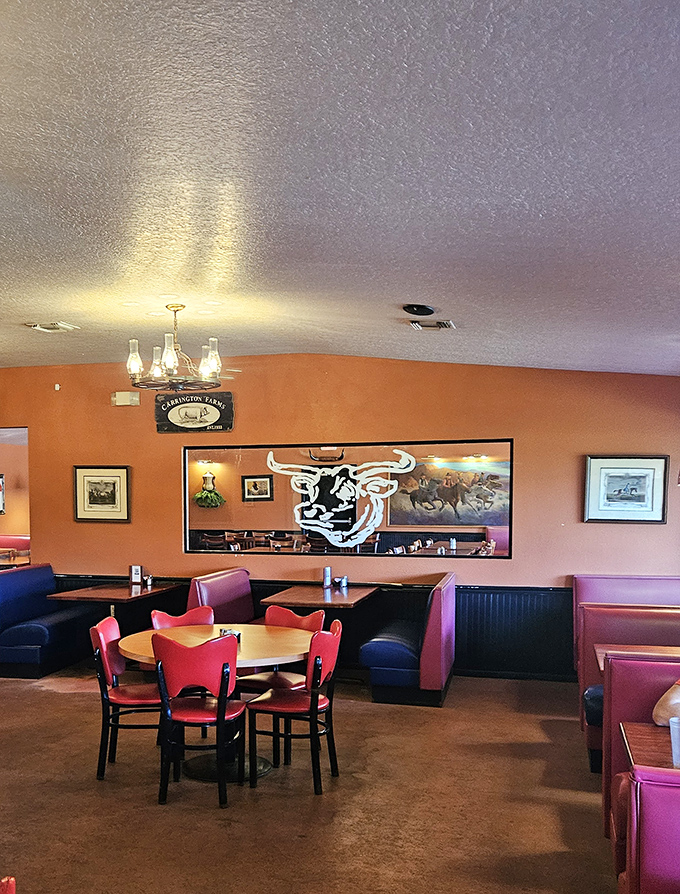 The cow silhouette watching over diners seems to say, "My sacrifice was not in vain." The red chairs silently agree.