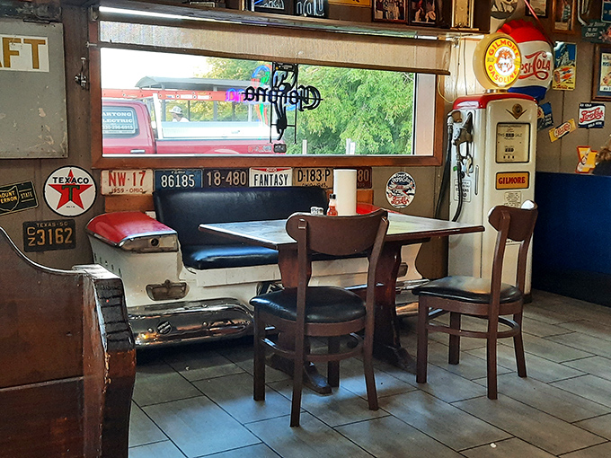 The car-seat-turned-booth isn't just clever recycling&mdash;it's the perfect spot to park yourself for a meal surrounded by vintage license plates. 