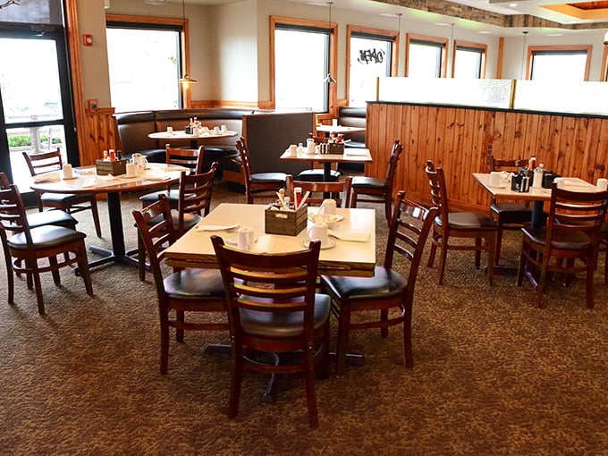 The dining room where strangers become regulars. Those wooden chairs have supported more heartfelt conversations than any therapist's couch.