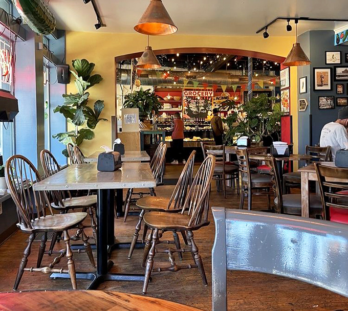 Plants and pendant lights create an atmosphere where you'll want to linger, plotting your next sandwich conquest while digesting your current victory.