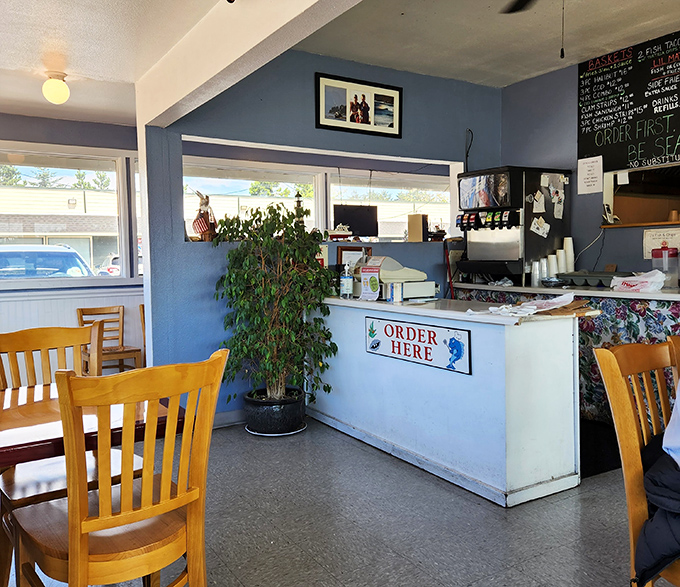 The ordering counter&mdash;where seafood dreams begin. That potted plant adds a homey touch to this no-nonsense operation.