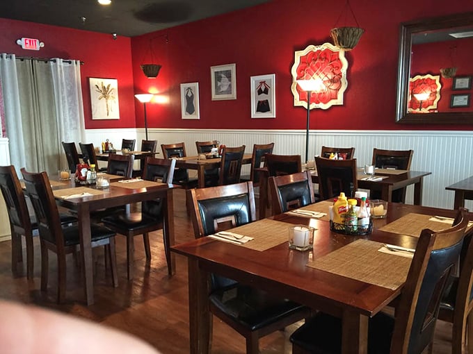 The crimson walls and warm wood tones create that perfect "neighborhood favorite" ambiance &ndash; elegant enough for special occasions, comfortable enough for Tuesday night dinner.