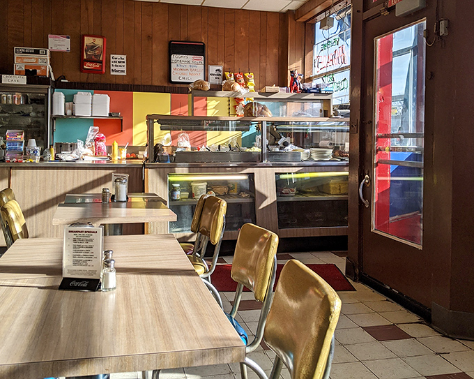 The deli counter view: where sandwich dreams are born and diet plans go to die, all under the warm glow of vintage lighting.