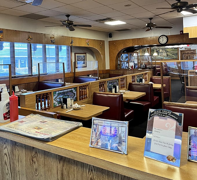 The dining room where time stands still. Wood paneling, ceiling fans, and booths designed for comfort rather than Instagram aesthetics.