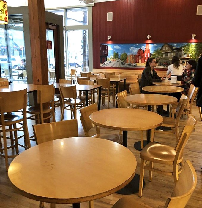 Round tables invite lingering conversations and spontaneous friendships. The mural of Little Italy on the wall reminds you exactly where carb paradise is located.