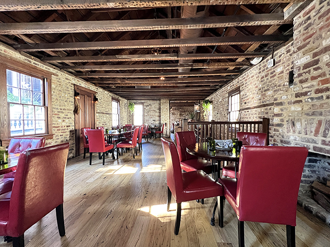 Exposed brick walls tell stories while red leather chairs invite you to stay awhile&mdash;this dining space feels like the coolest history class you've ever attended.