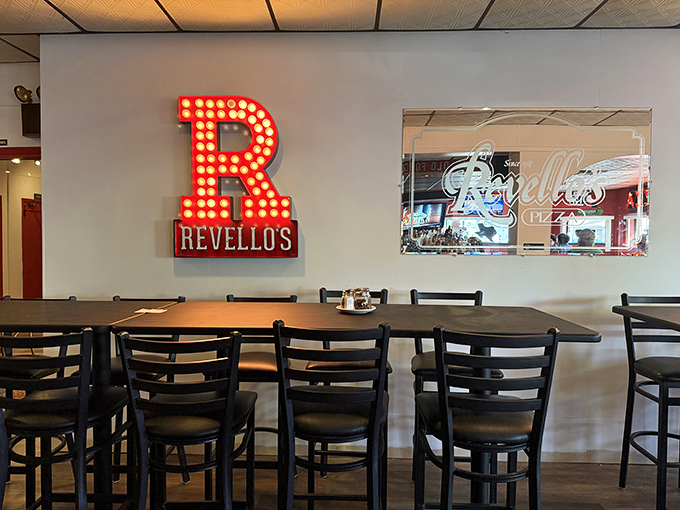 The illuminated "R" isn't just a letter&mdash;it's a landmark that's guided hungry travelers to pizza paradise for decades.