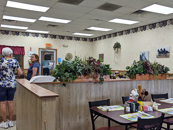 Plants and horse-themed decor create that quintessential country restaurant vibe&mdash;like dining in the cozy corner of a rural Indiana living room.