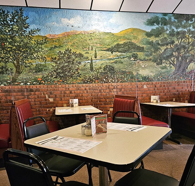 The Italian countryside mural watches over diners like a benevolent nonna, promising that calories consumed beneath it somehow don't count.