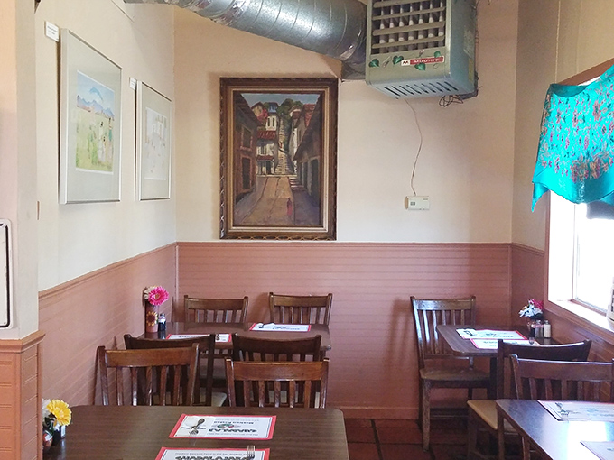 Pink wainscoting and simple wooden chairs create an unpretentious backdrop where the food becomes the undisputed main character.