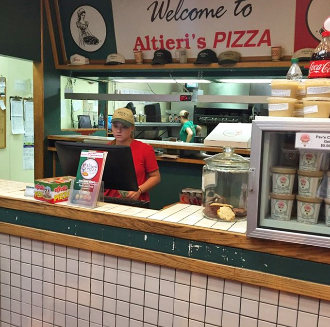 The "Welcome to Altieri's" sign promises not just food, but an experience&mdash;like being invited to a family dinner where everyone's favorite uncle cooks.