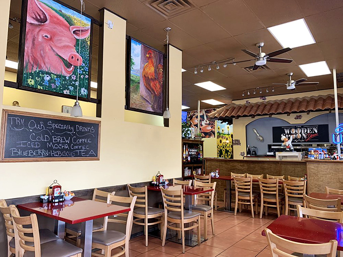 Farm-inspired artwork watches over diners like friendly guardians, while the chalkboard tempts with specials that rarely disappoint.