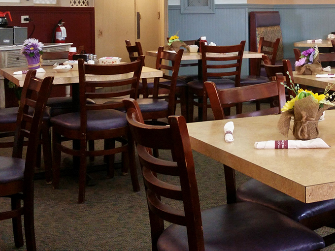 Simple tables adorned with cheerful flowers create that rare atmosphere where both first dates and family reunions feel equally at home.