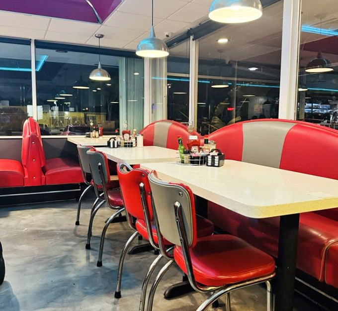Red and chrome: the color palette of American comfort. These booths have heard more confessions than most priests.