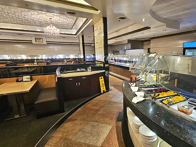 The buffet's elegant layout invites strategic planning. Veterans know to survey the entire battlefield before committing to their first plate.