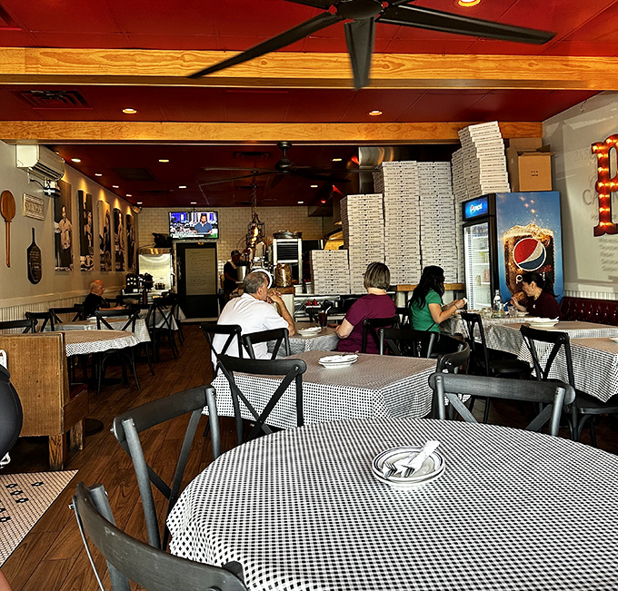 Where wooden beams meet red ceilings and stacked pizza boxes promise good things to come. The kind of place where calories don't count.