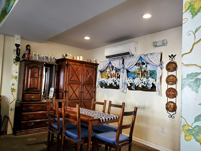 Decorative copper pots and wooden cabinets create a dining space that feels like you've stumbled into a German grandmother's treasured kitchen.