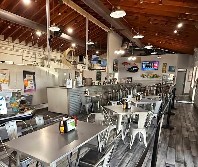 Metal chairs that don't promise comfort but deliver something better: proximity to seriously good seafood in an honest setting.