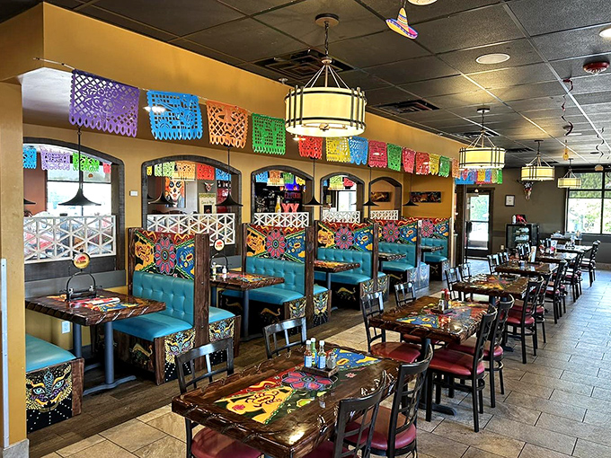 Papel picado banners dance overhead while turquoise booths invite you to settle in. Mexican restaurant design 101: color equals happiness.