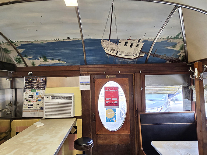 A mural of Chesapeake Bay sailing life watches over diners&mdash;because even painted boats get hungry for good cooking.