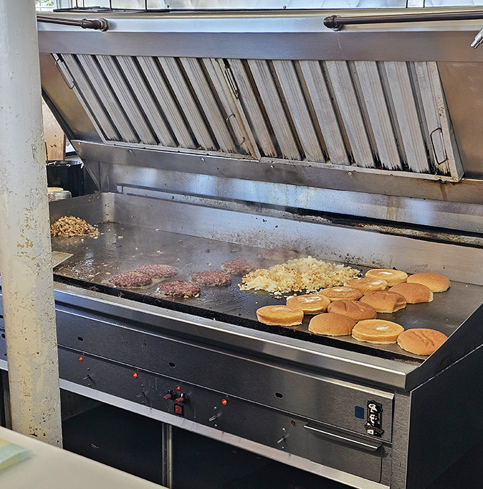 Burger alchemy happens here. The flat-top grill where ordinary ingredients transform into extraordinary meals through the magic of heat and experience.