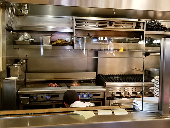 Behind the scenes, the kitchen's well-seasoned grill tells stories of thousands of perfectly cooked meals—the true unsung hero of Joe's enduring success.