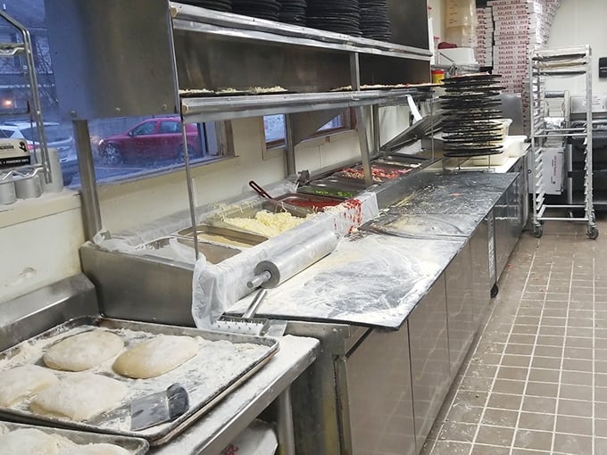 The pizza assembly line reveals the secret to consistency&mdash;fresh dough waiting to be transformed into the pies that put Alibi on the map.