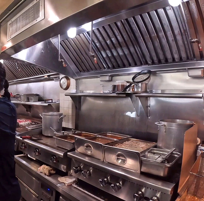 Behind the scenes where the magic happens &ndash; a spotless kitchen with equipment that's seen more sandwich action than a Food Network marathon.