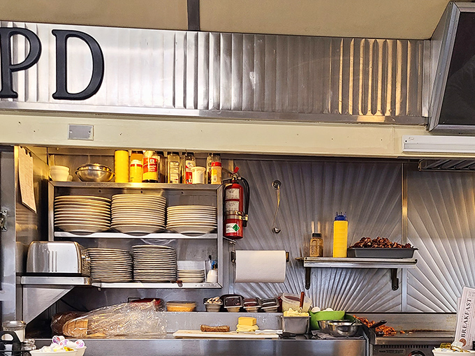Behind every great diner is a kitchen where magic happens. Stacks of plates await their moment to carry treasures from griddle to grateful patron.