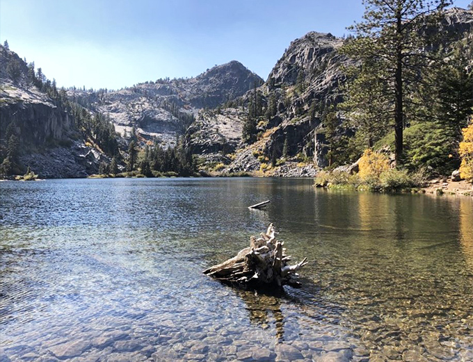 Eagle Lake sits like a mirror reflecting heaven, making you wonder if Bob Ross painted this place.