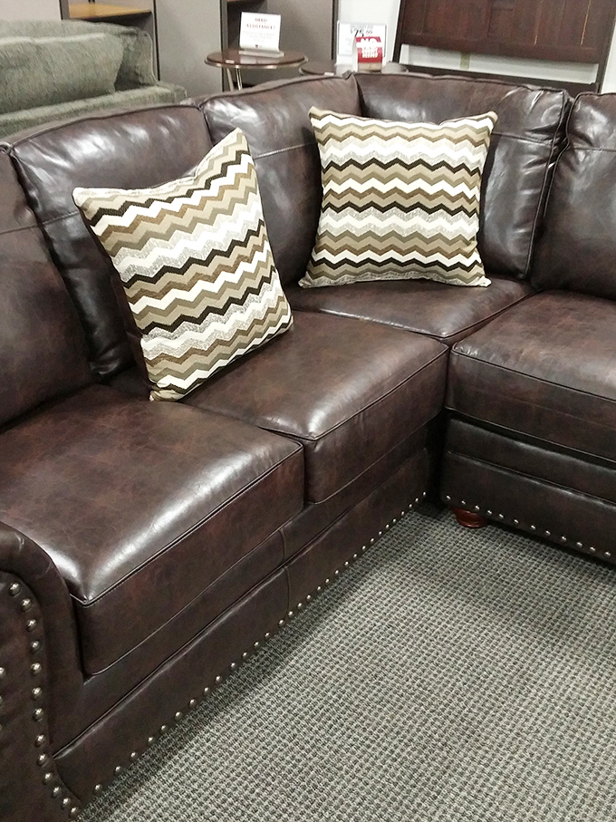This leather sectional with its chevron pillows isn't just furniture—it's someone's future "I can't believe I found this" story.