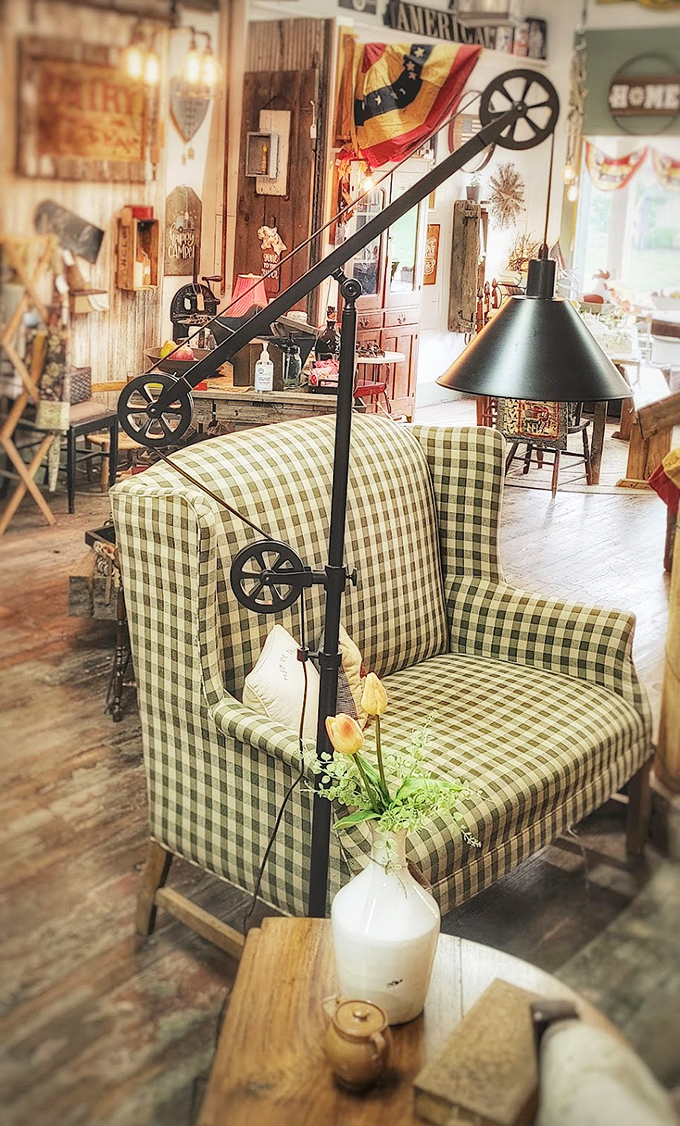 That green checkered chair isn't just offering a seat&mdash;it's inviting you to slow down and notice the details. Industrial lighting meets country comfort.