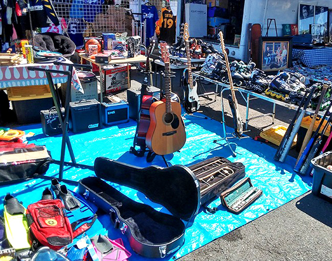 A musician's yard sale paradise. That acoustic guitar has probably played everything from "Wonderwall" to wedding proposals in its storied life.