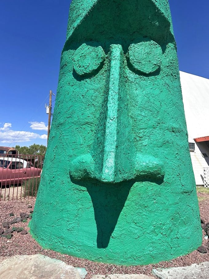 The head's stern profile against the brilliant blue Arizona sky creates the perfect backdrop for your "yes, I actually went there" photo.