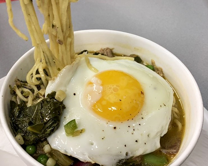 Noodle bowl with a sunny-side egg that's basically winking at you. East meets South in this bowl of cross-cultural comfort.
