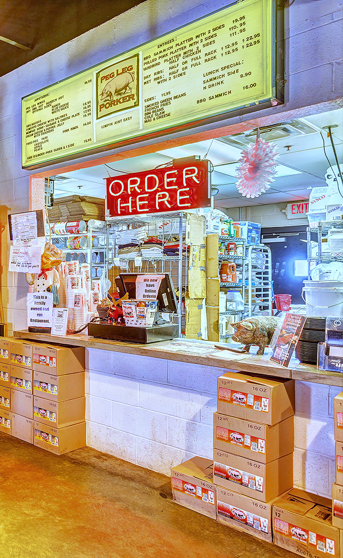 The "ORDER HERE" sign glows like the North Star for hungry pilgrims seeking guidance on their journey to barbecue enlightenment.